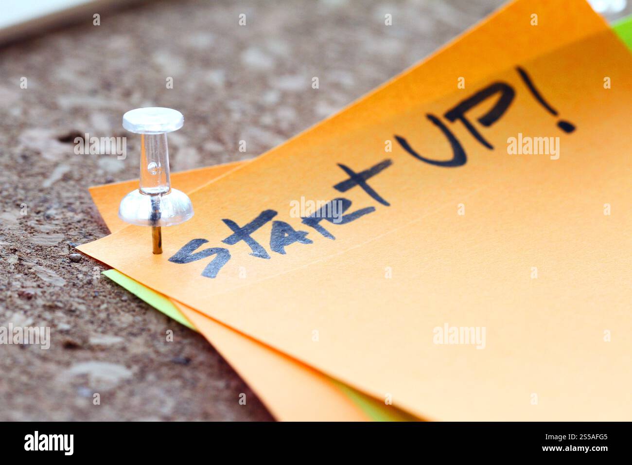 close up of pin and hand drawn business strategy graph chart on sticky ...