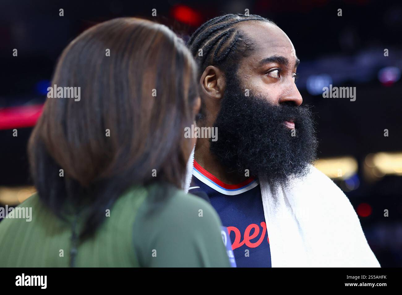 Los Angeles Clippers guard James Harden looks on during an interview ...