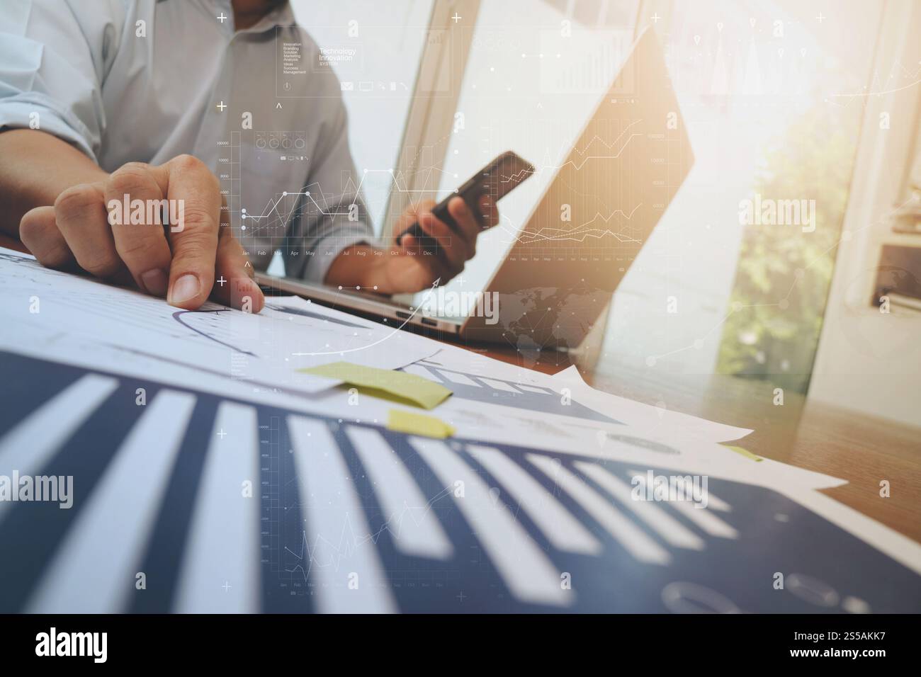 business man hand working on laptop computer on wooden desk with ...