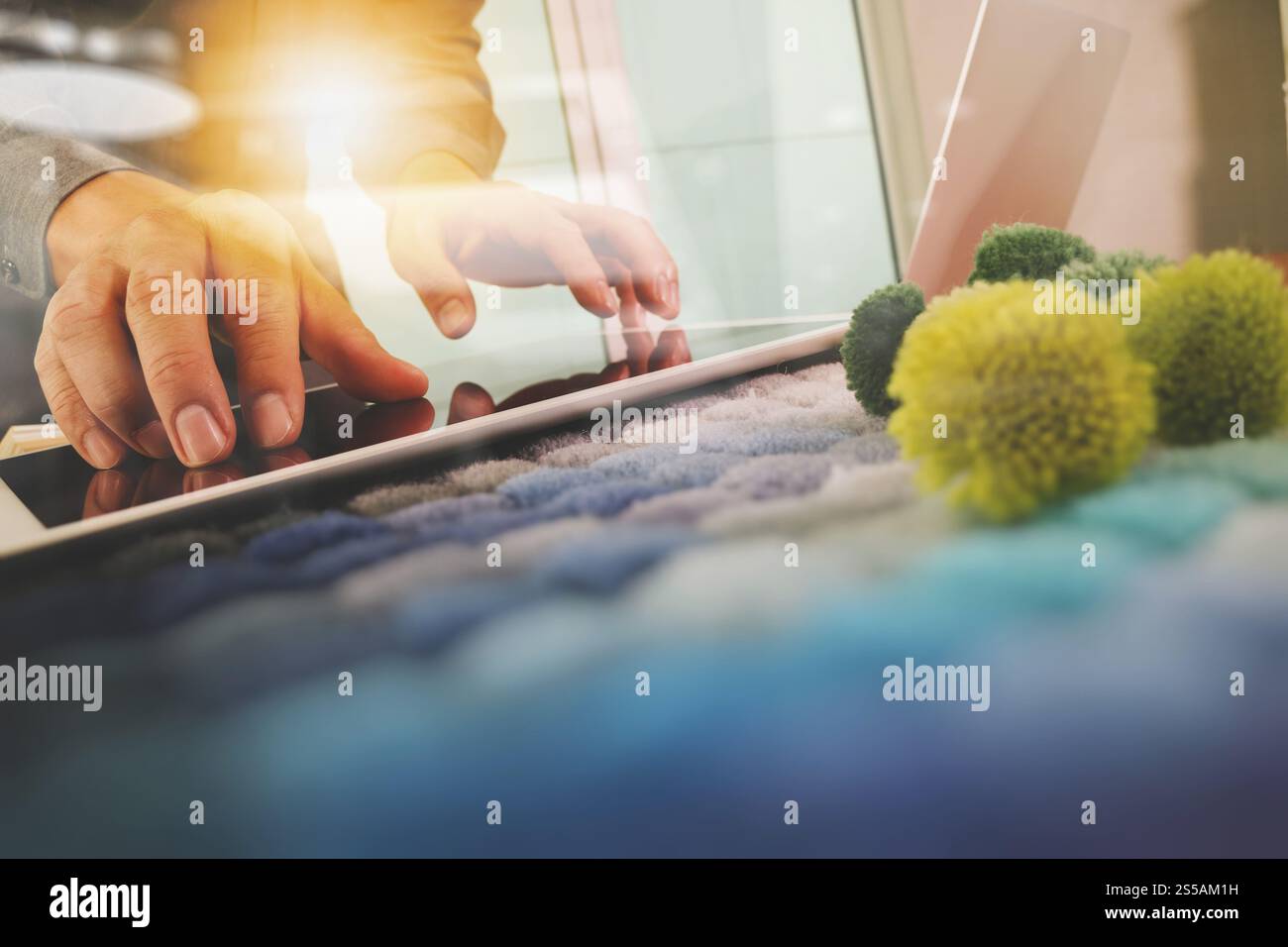 Interior designer hand chosing carpet sample with blank new modern ...