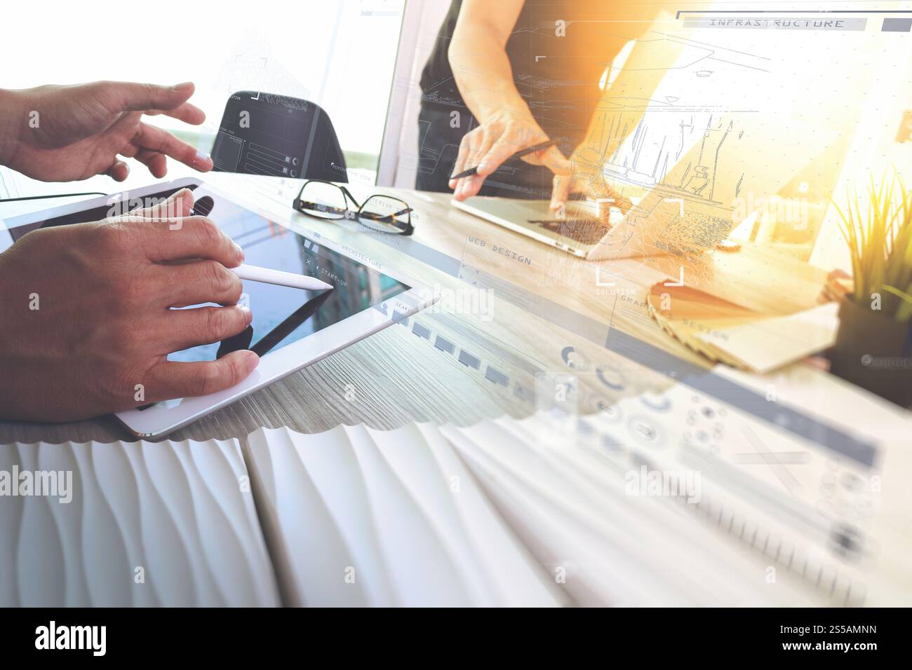 two colleagues interior designer discussing data and digital tablet and ...