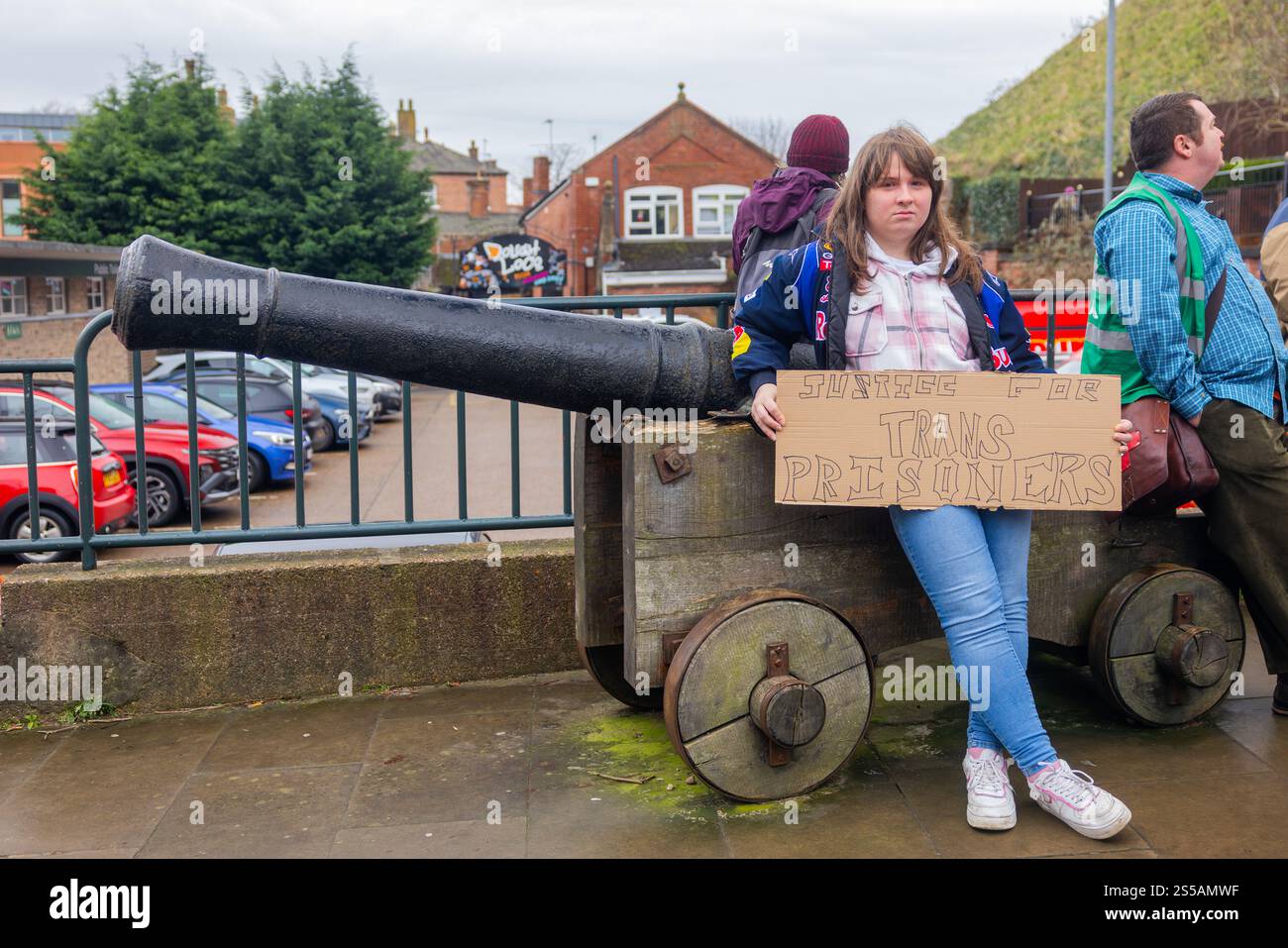 Lincoln, UK. 13 JAN, 2025. Protestor holds sign next to cannon as ...