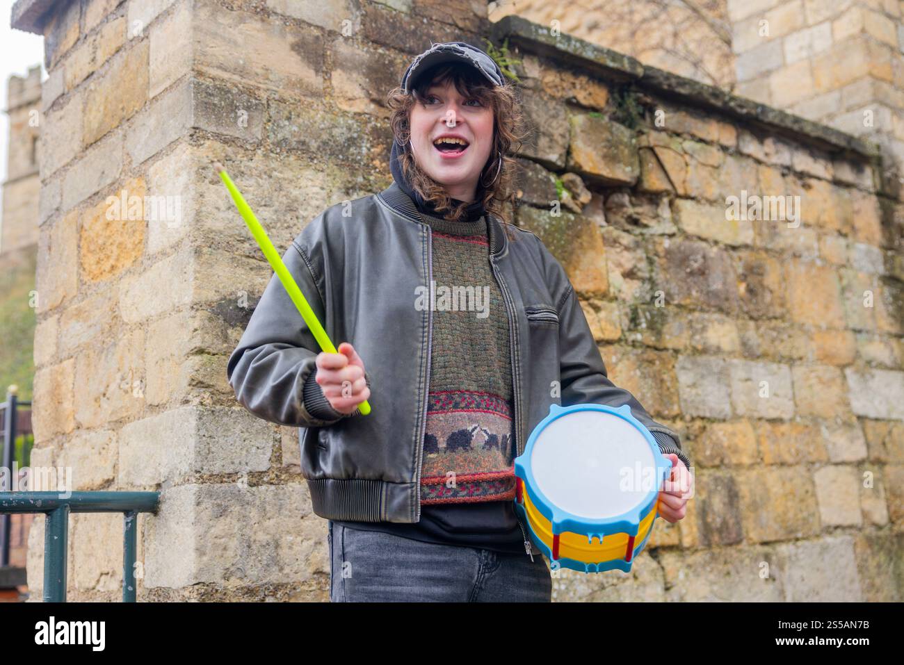 Lincoln, UK. 13 JAN, 2025. Drum is banged as activists gathered outside ...