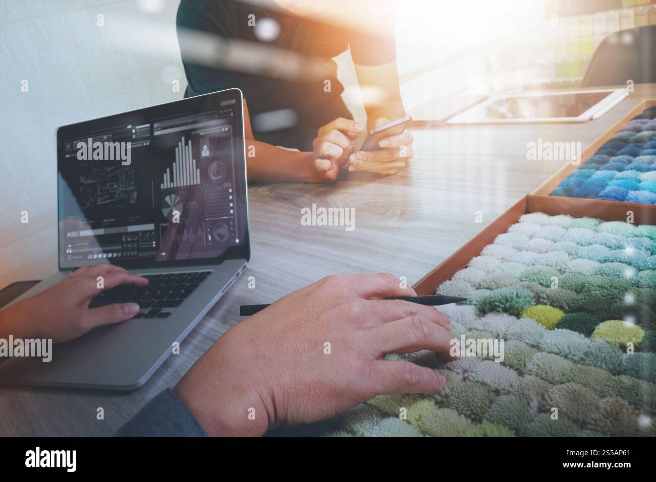 colleagues interior designers discussing data with new modern computer ...