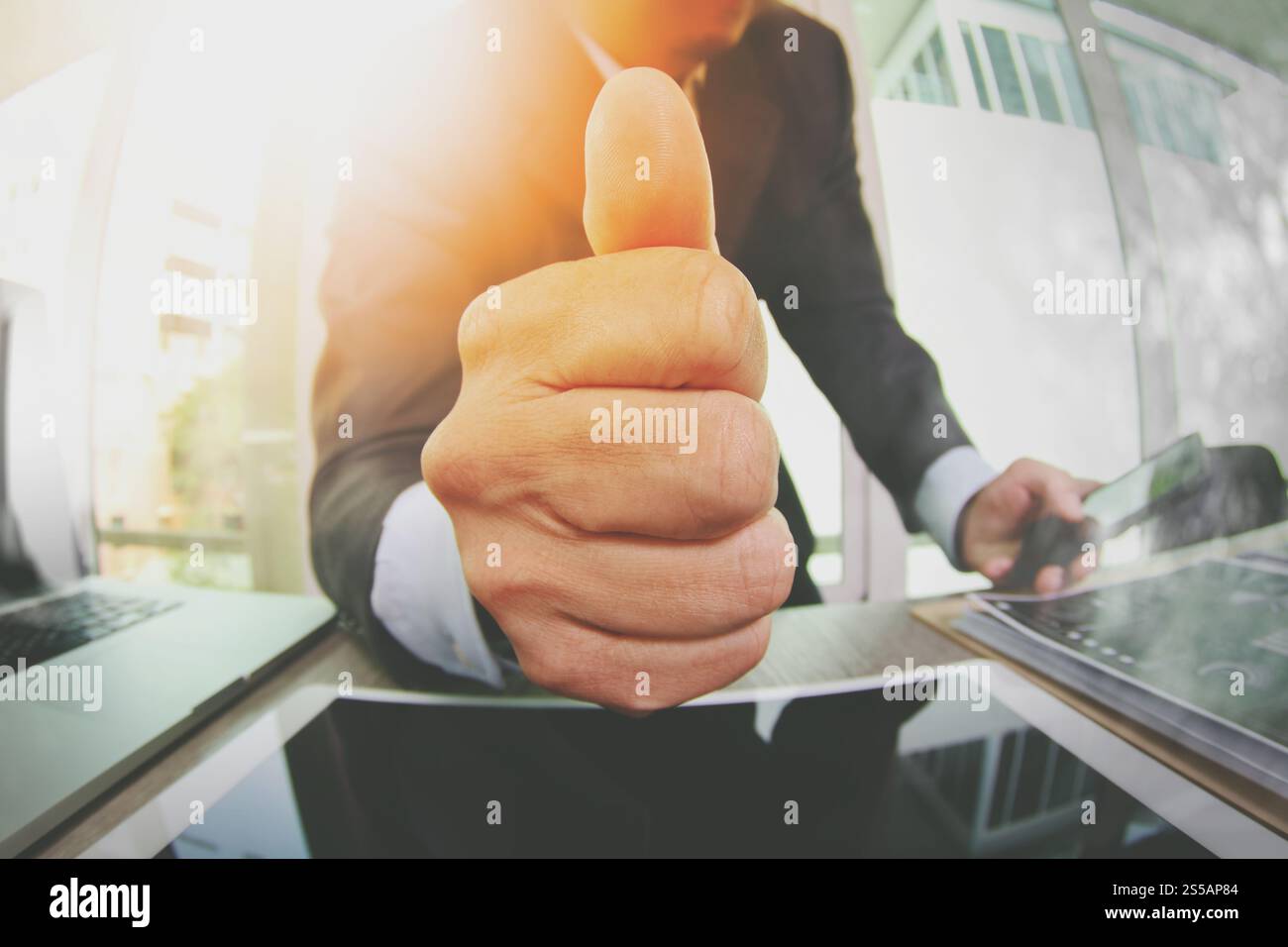 close up of businessman giving thumbs up in his office as concept Stock Photo - Alamy