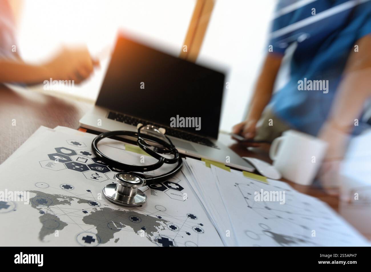team doctor working with laptop computer in medical workspace office ...