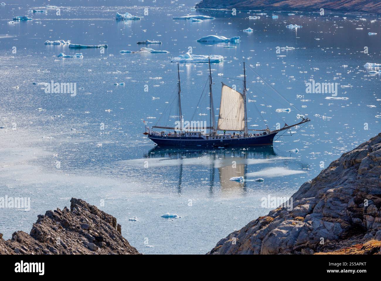 A beautiful 3 mast sailing ship in the icy, blue waters of Dickson ...