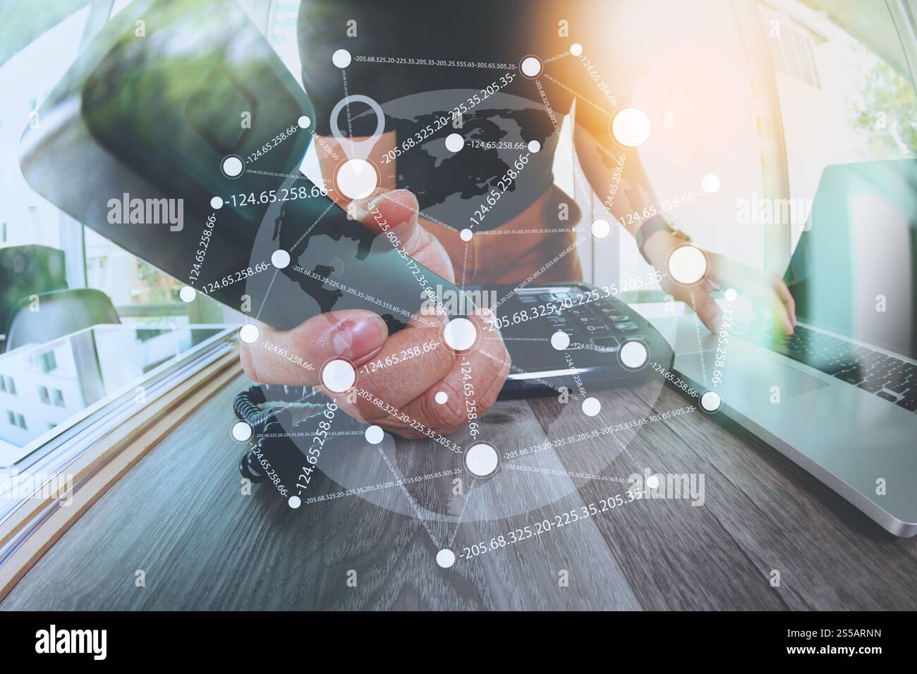 close up of designer hand holding telephone in the office as concept ...