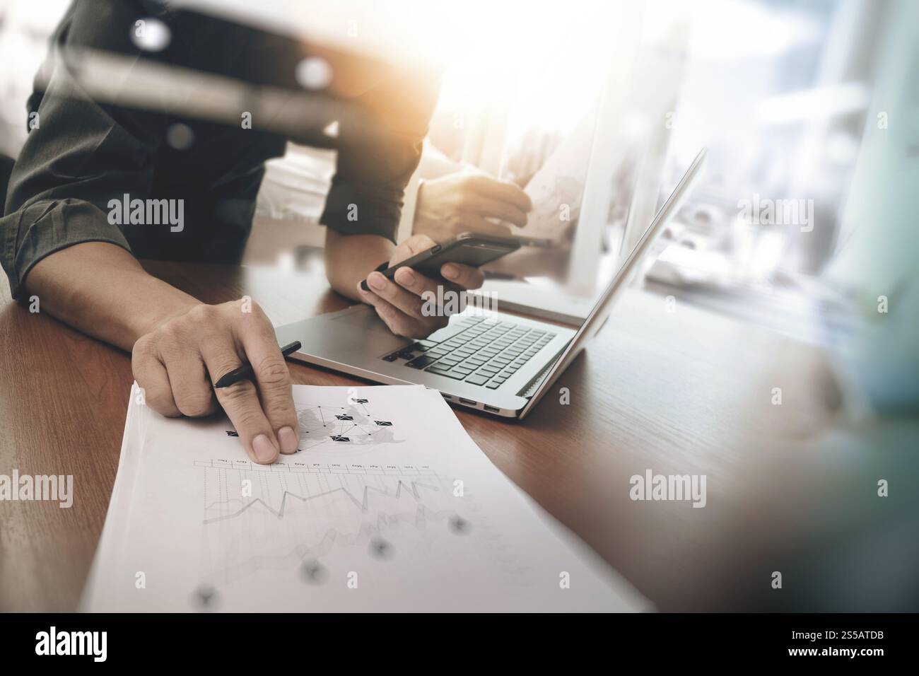 business man hand working on laptop computer with digital layer ...