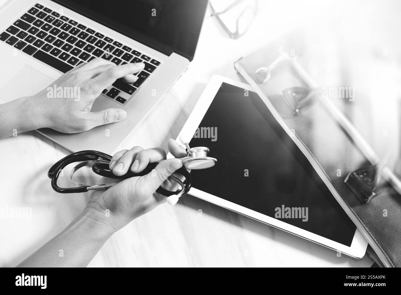Professional doctor working laptop Black and White Stock Photos ...