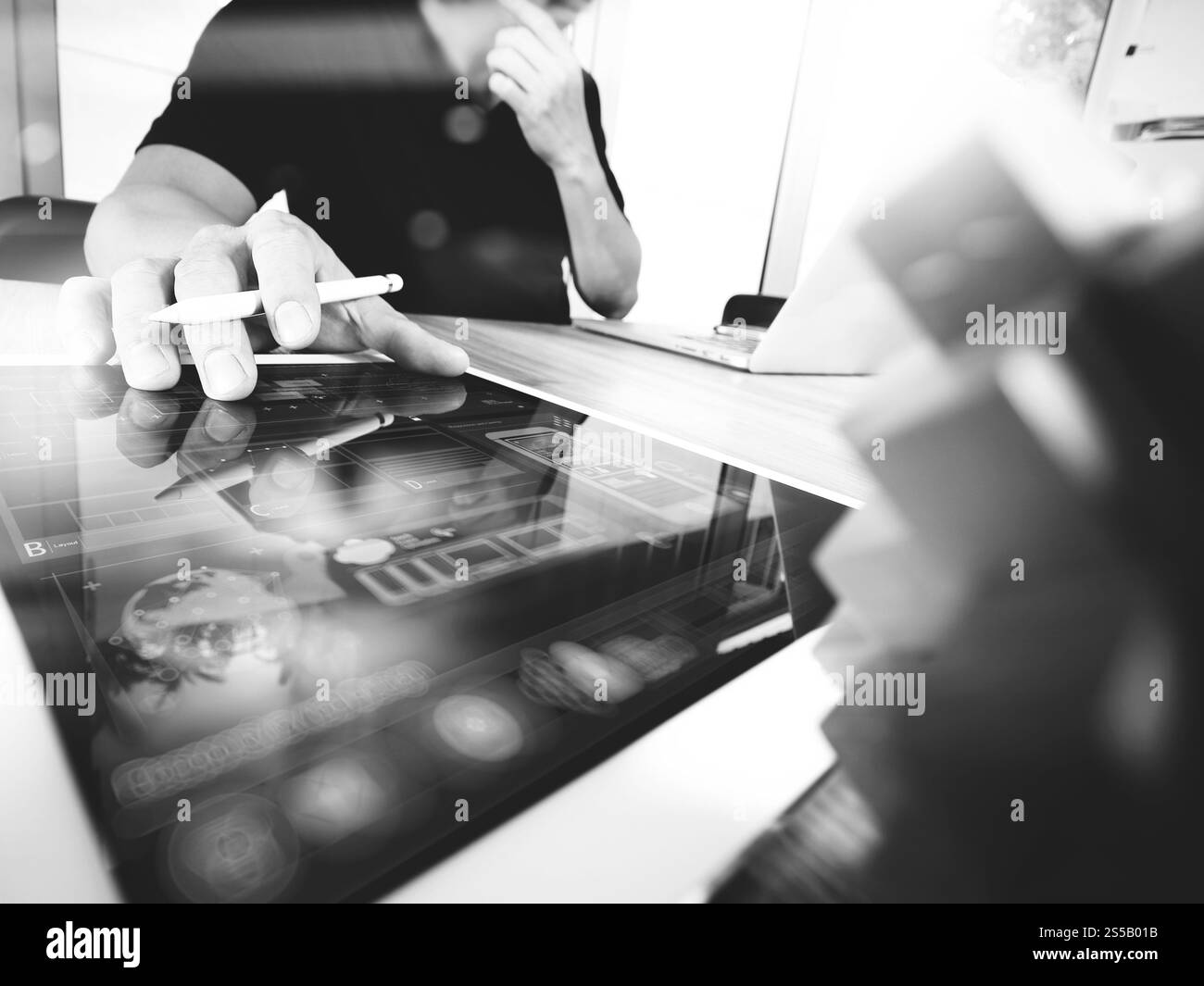 creative hand working digital tablet and wood puzzle with laptop ...