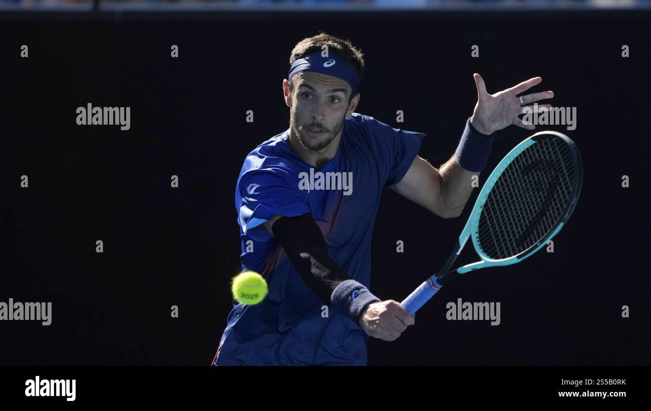 Lorenzo Musetti of Italy plays a backhand return to Matteo Arnaldi of ...