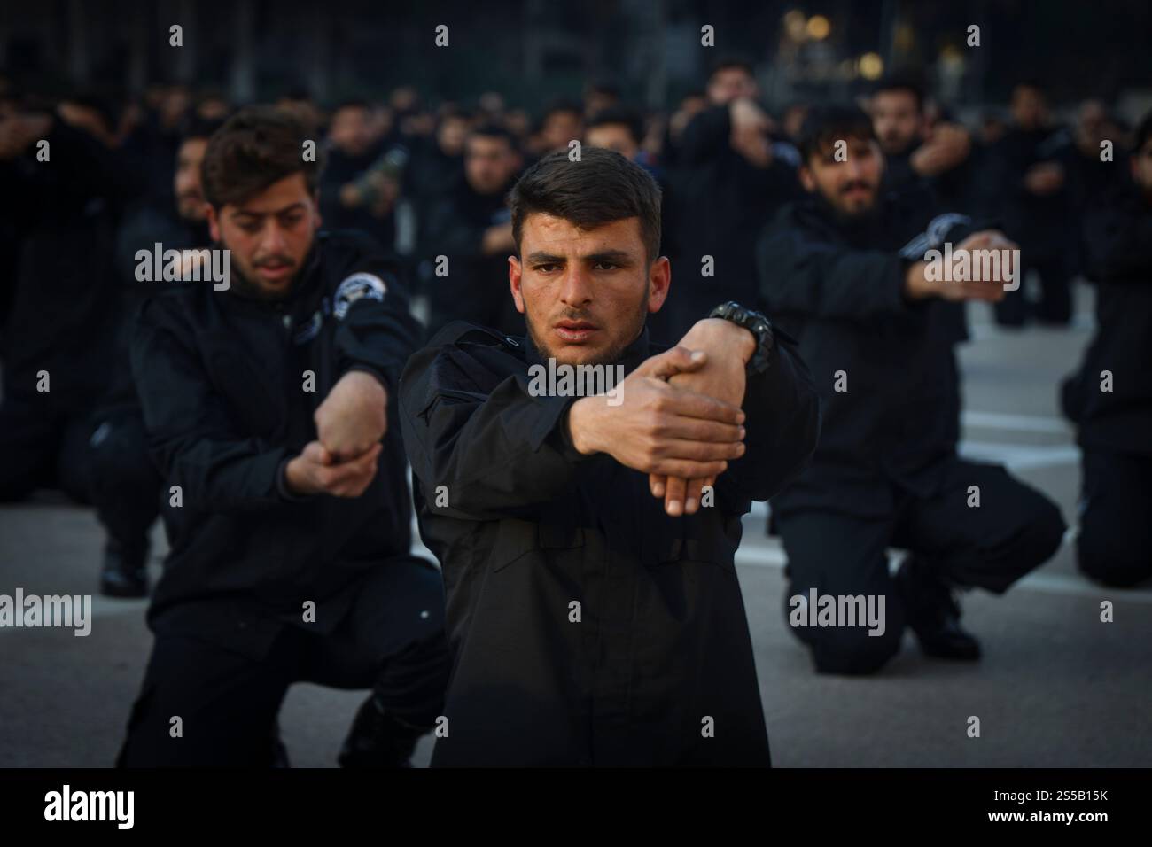 Recruits for the new government's police force exercise during a ...