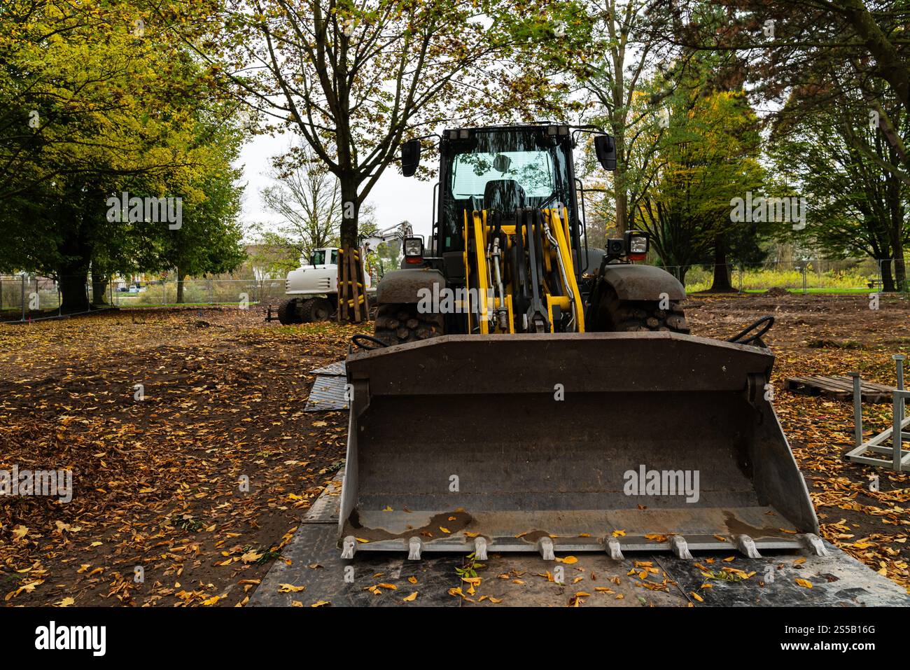 Construction site featuring a front loader parked in an area covered ...