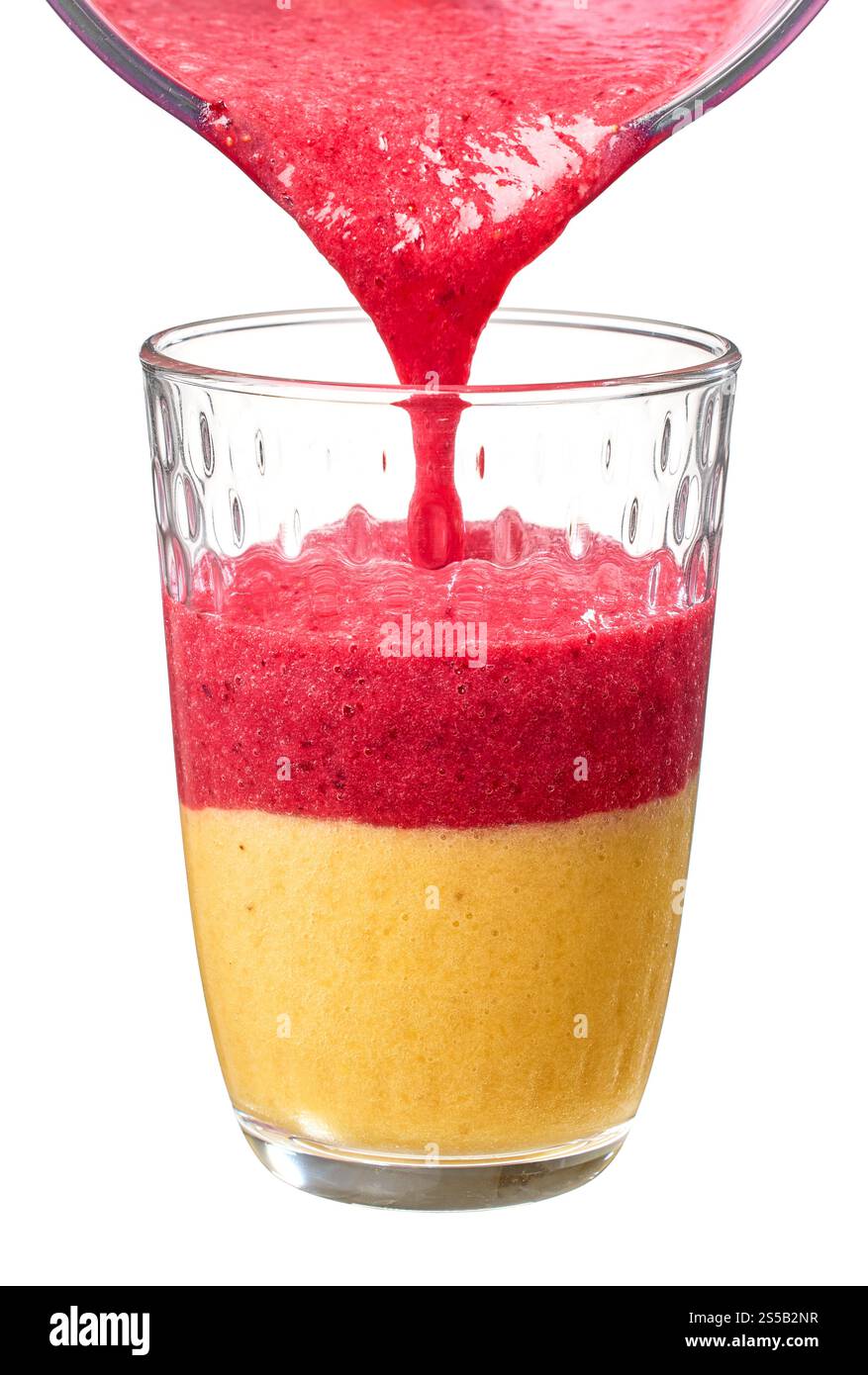 fresh colorful smoothie pouring in glass isolated on white background ...