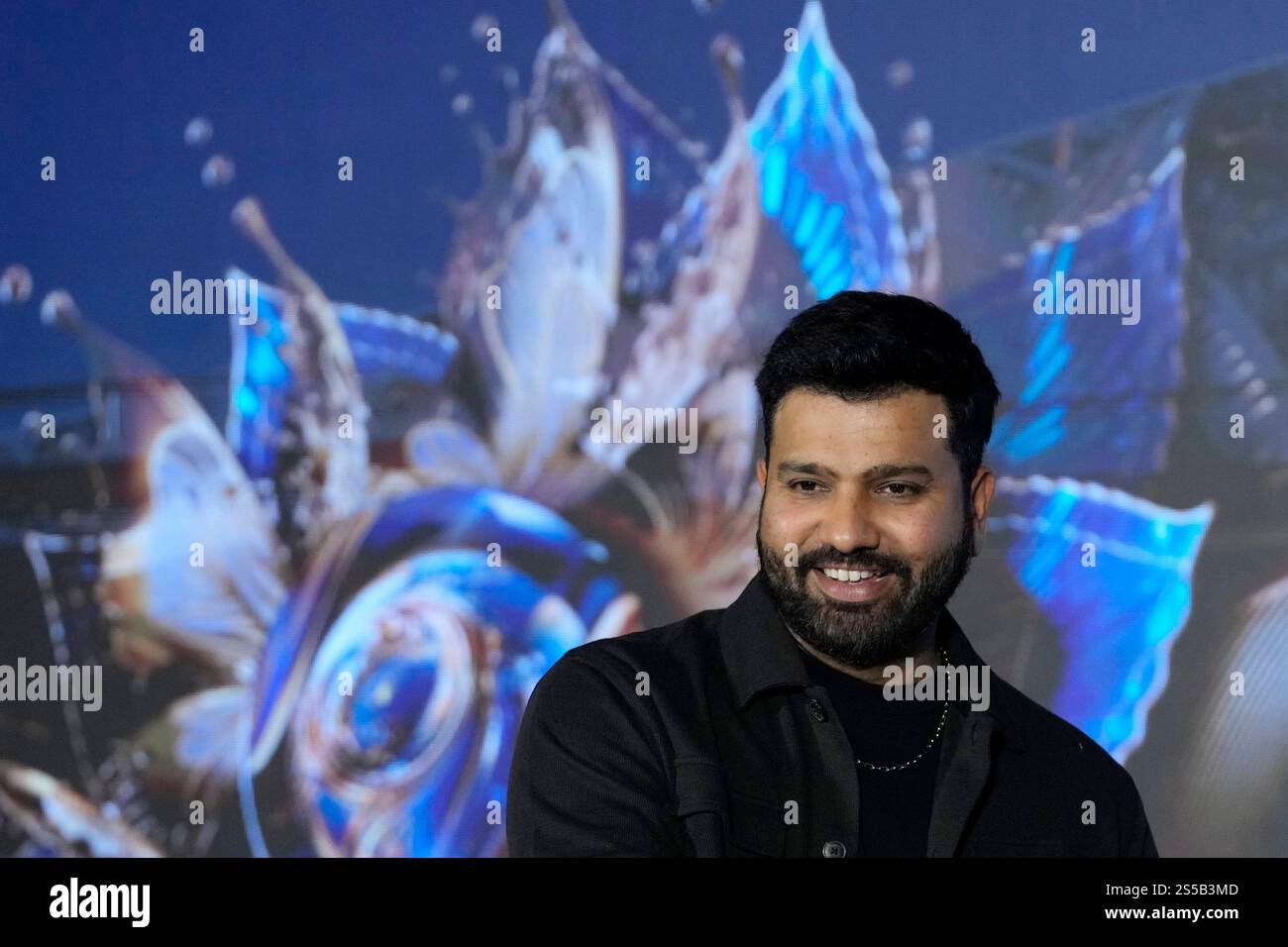 Indian cricketer Rohit Sharma smiles during a promotional event in ...