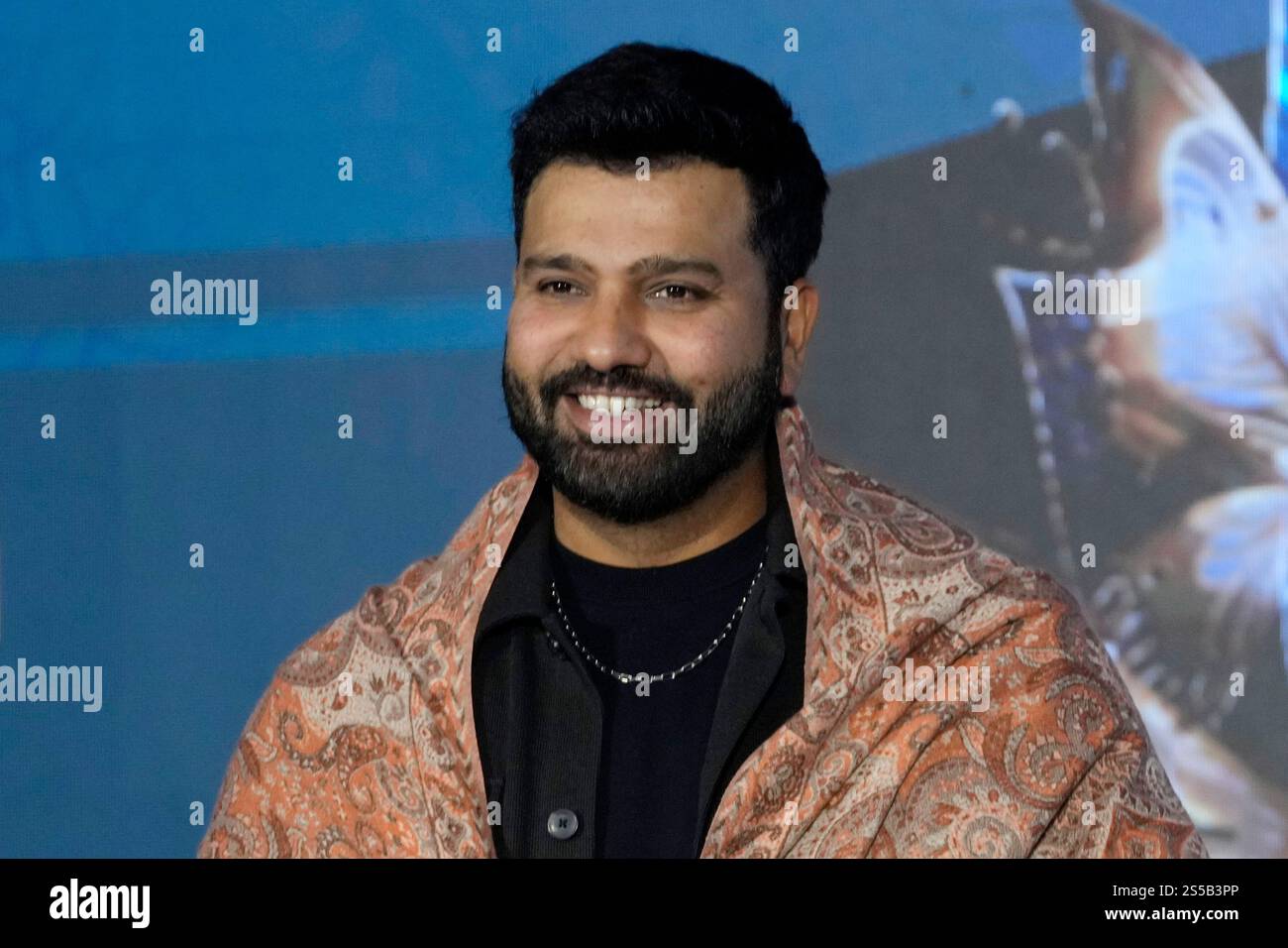 Indian cricketer Rohit Sharma smiles during a promotional event in ...