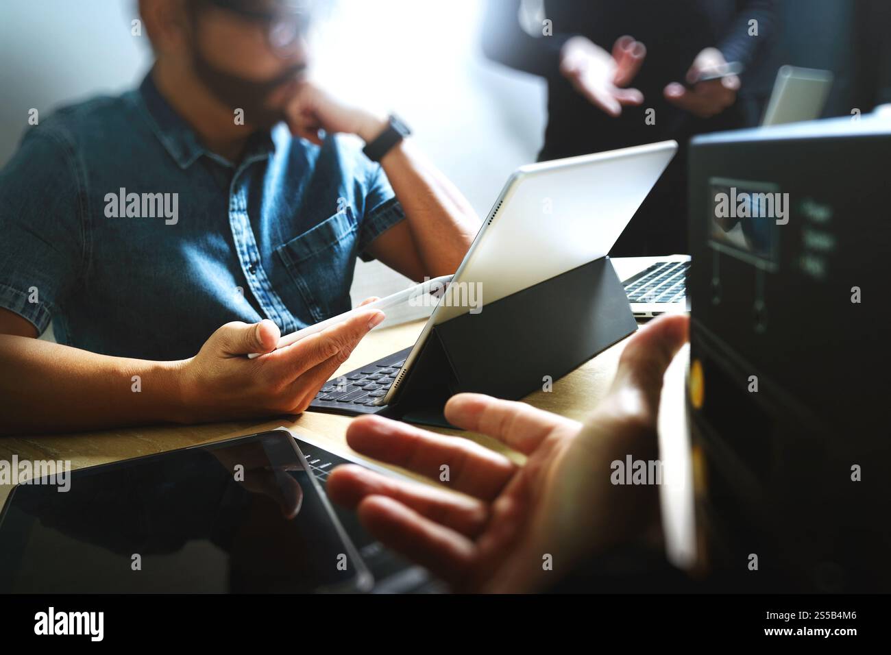 StartUp Programming Team. Website designer working digital tablet dock ...