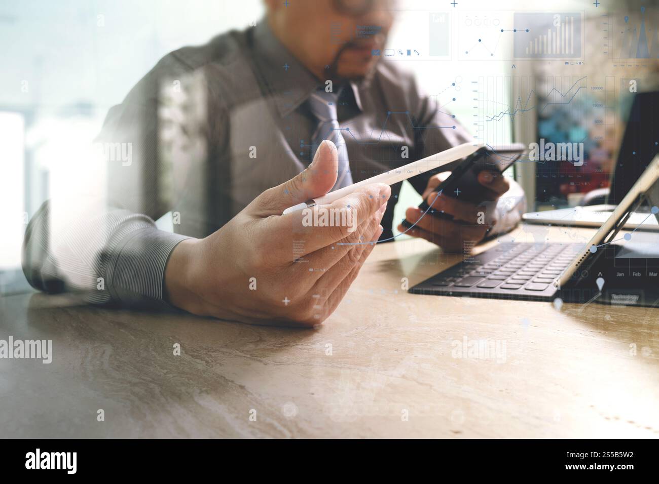 businessman working with new start up project.using smart phone digital tablet docking smart ...
