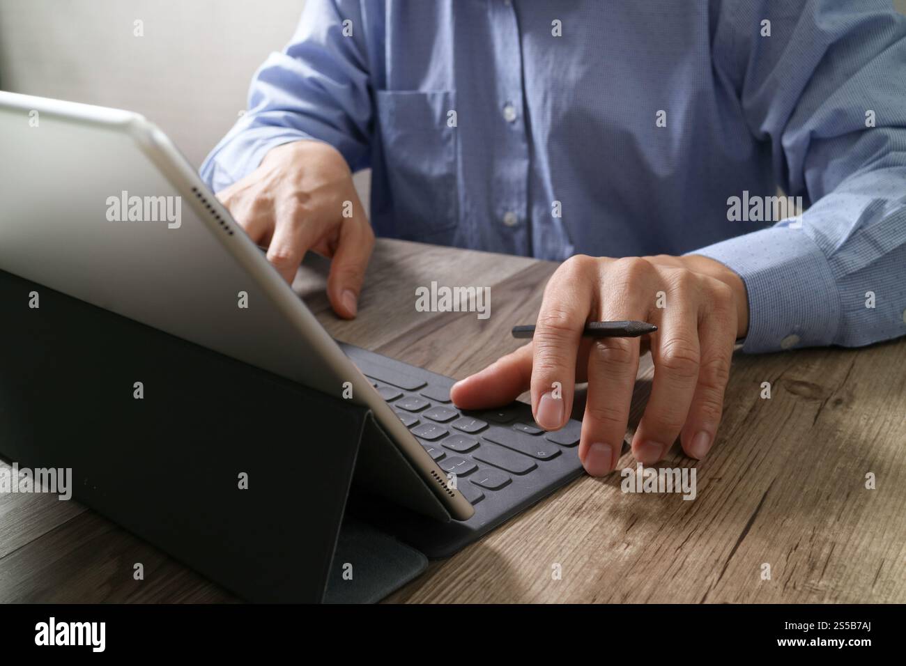 success businessman hand using stylus pen,digital tablet docking smart ...