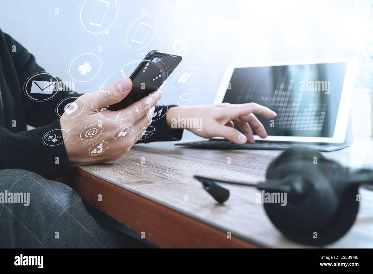 man hand using VOIP headset with digital tablet computer docking ...