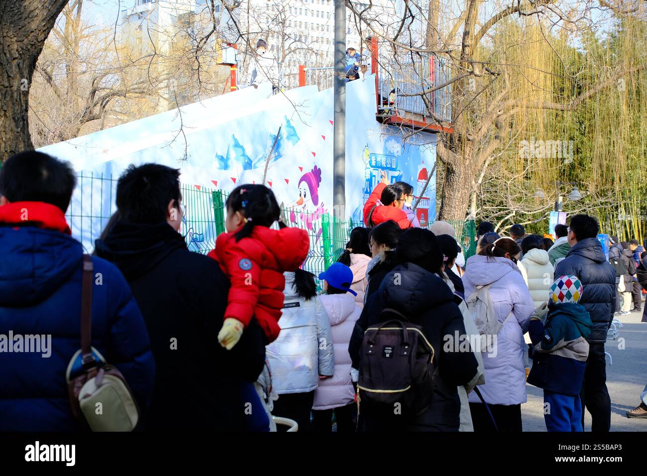 Tourists experience the long ice slide at Purple Bamboo Park in Beijing ...