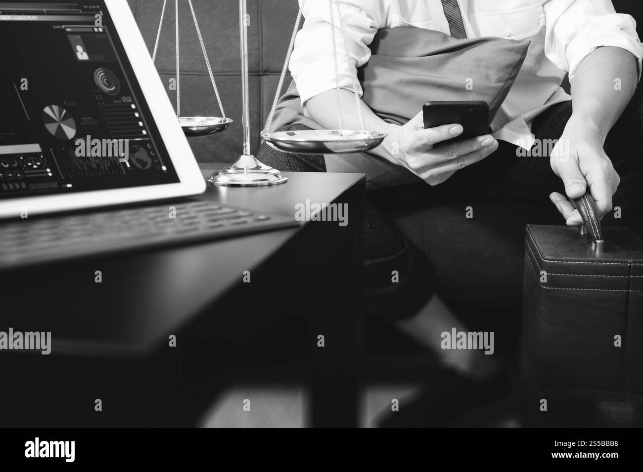 Justice and Law context.Male lawyer hand sitting on sofa and working with smart phone,digital ...
