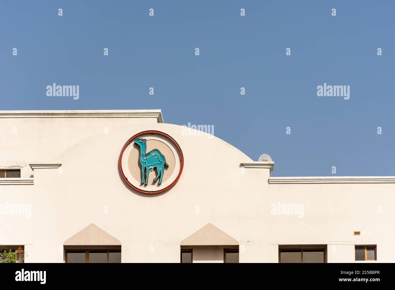 A building facade with a camel emblem in Dubai City, United Arab ...