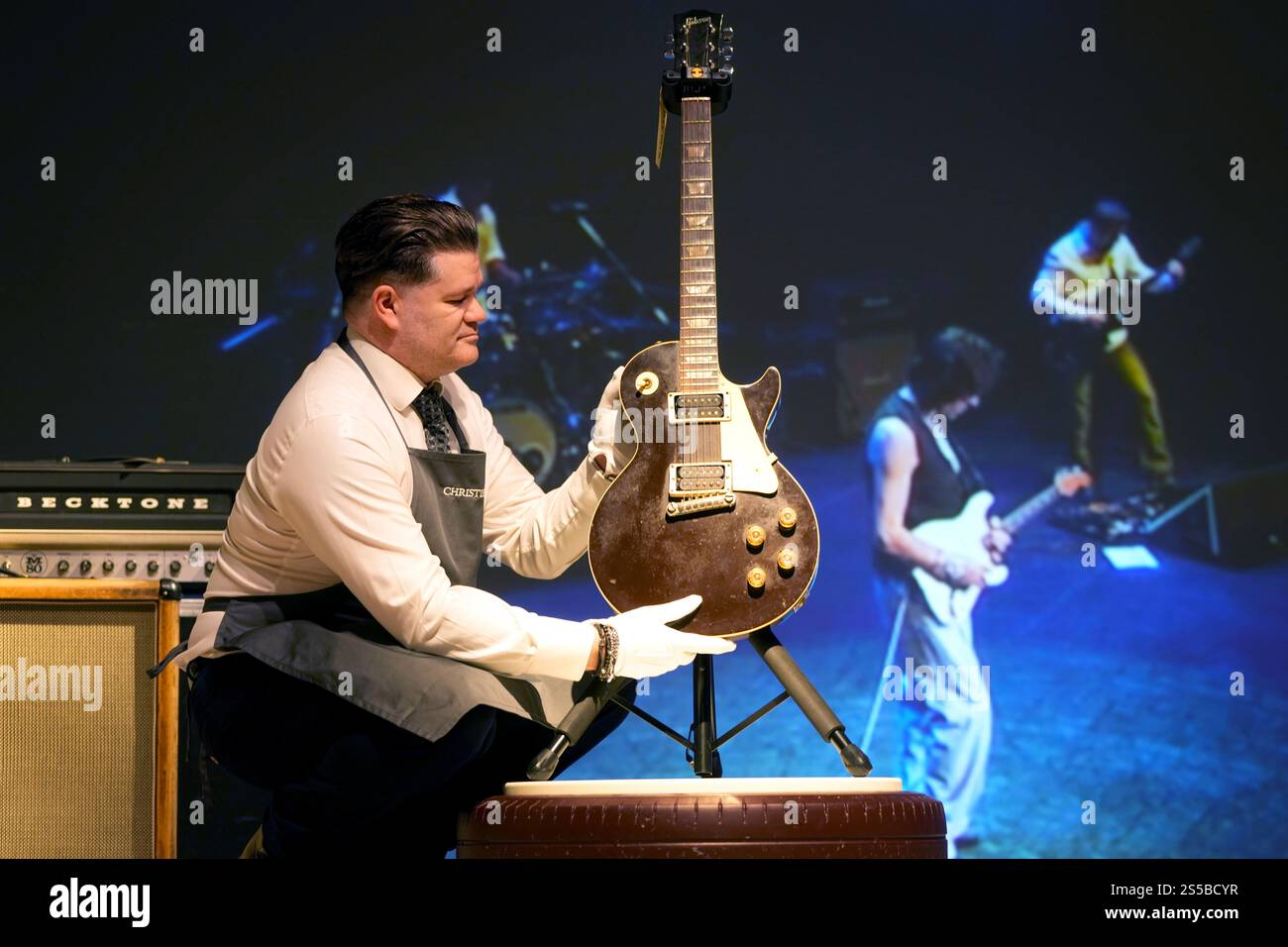 An art handler displays a Gibson, Kalamazoo, Michigan, 1954 and 1972 A ...