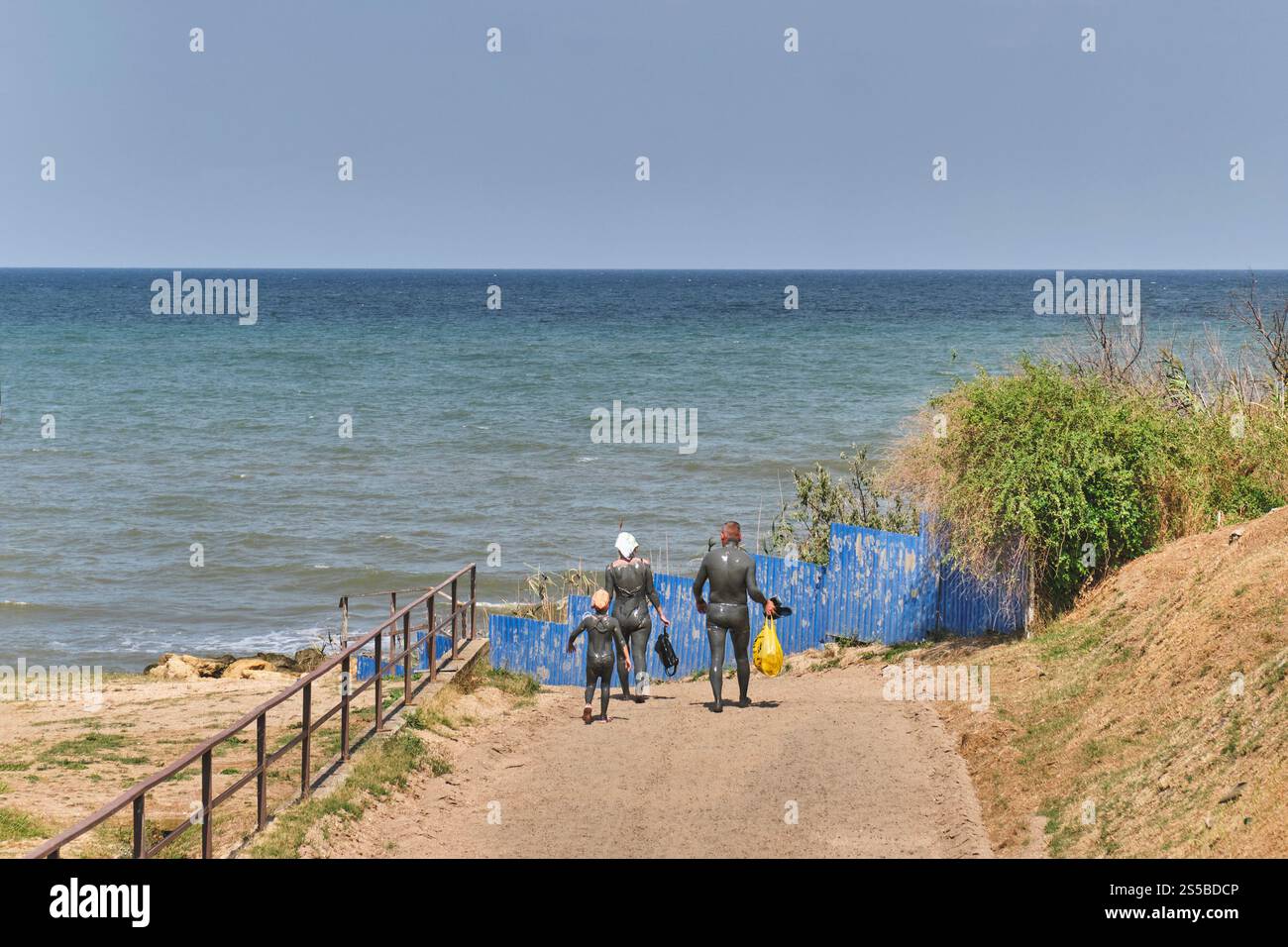 Anapa, Russia - September 1, 2024: Family of three covered in ...