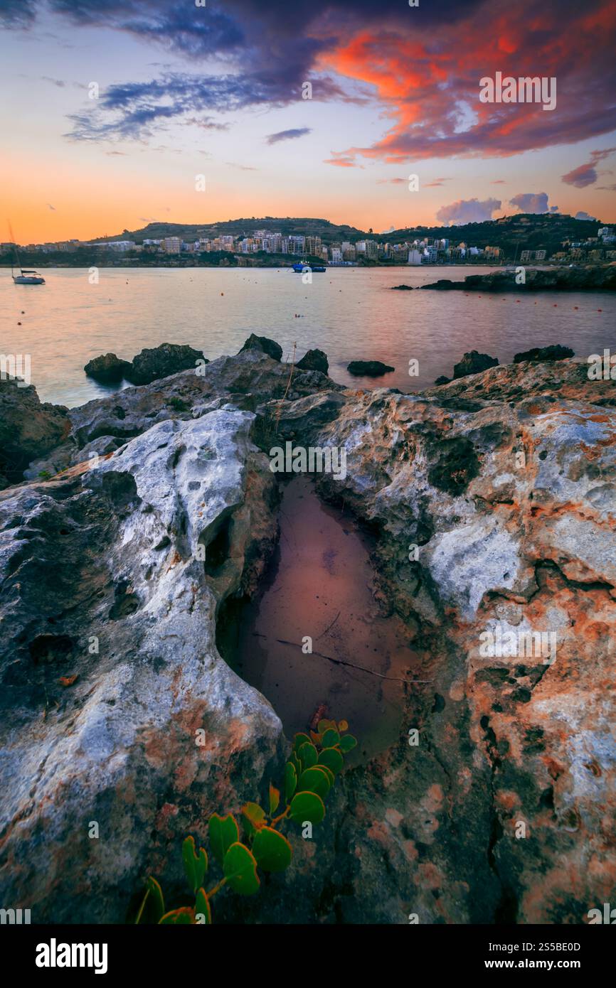 Coastal landscape at sunrise, St Pauls Bay, Bugibba, Malta Stock Photo ...