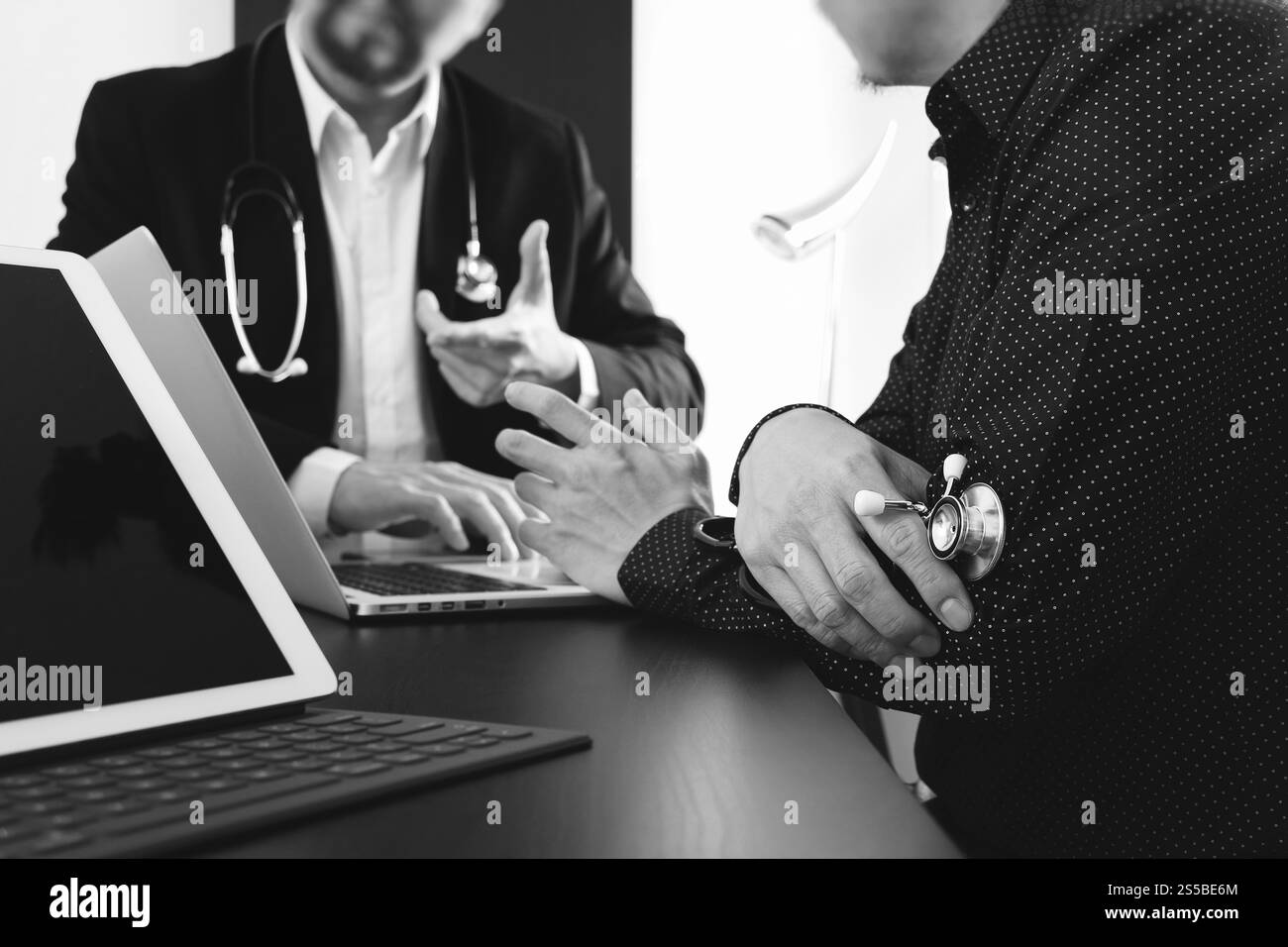 Professional doctor working laptop Black and White Stock Photos ...