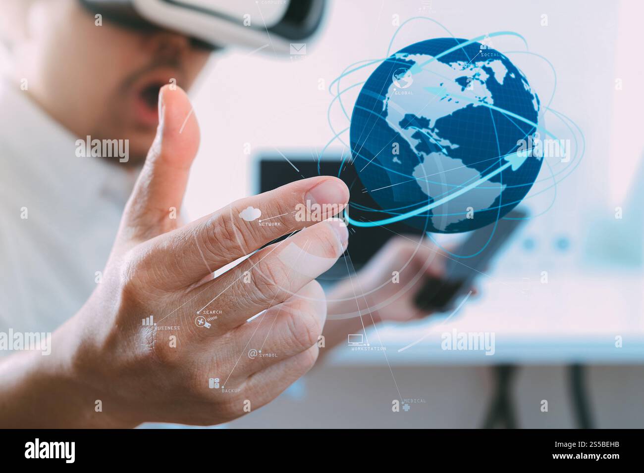 businessman wearing virtual reality goggles in modern office with ...