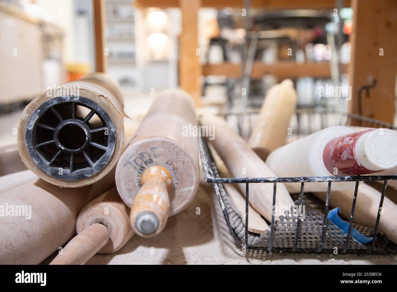 Close-up of assorted rolling pins and pottery tools in a pottery studio ...