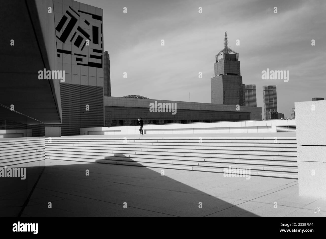 a modern urban scene of architectural elements. There are wide, shallow ...