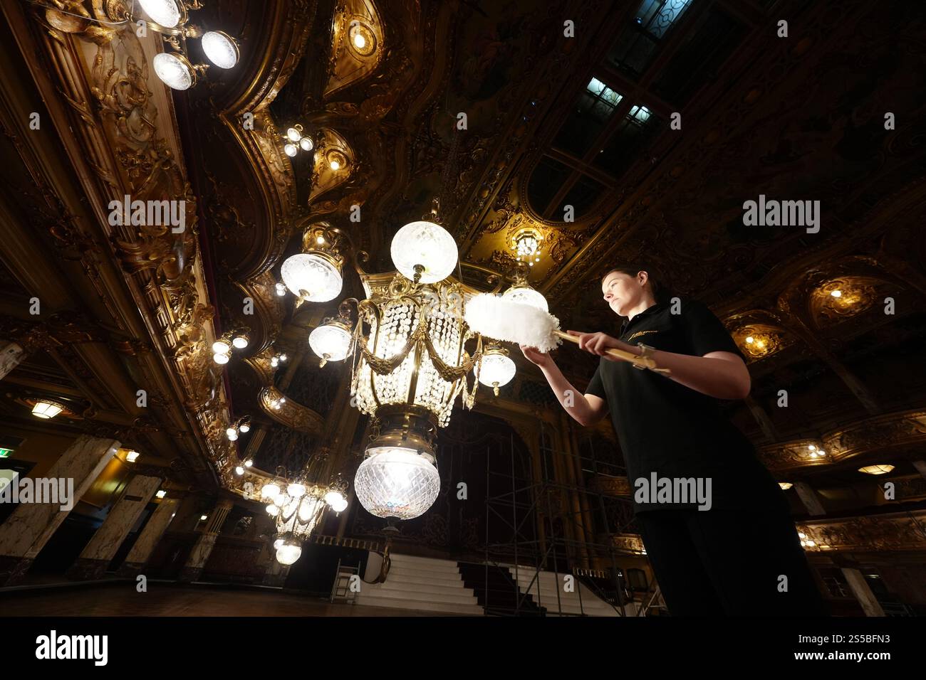 Tower ballroom team member Jennifer Allinson cleans one of the twelve ...