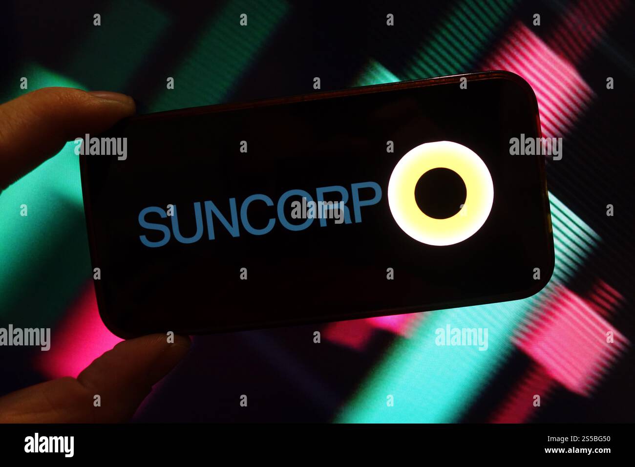 In this photo illustration, the Suncorp company logo is seen displayed ...