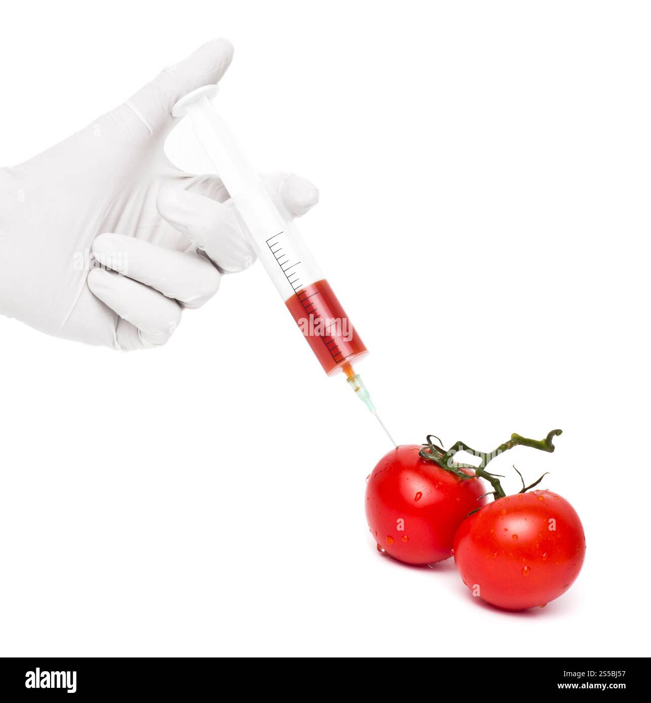Gmo product concept: Tomato injection isolated Stock Photo - Alamy