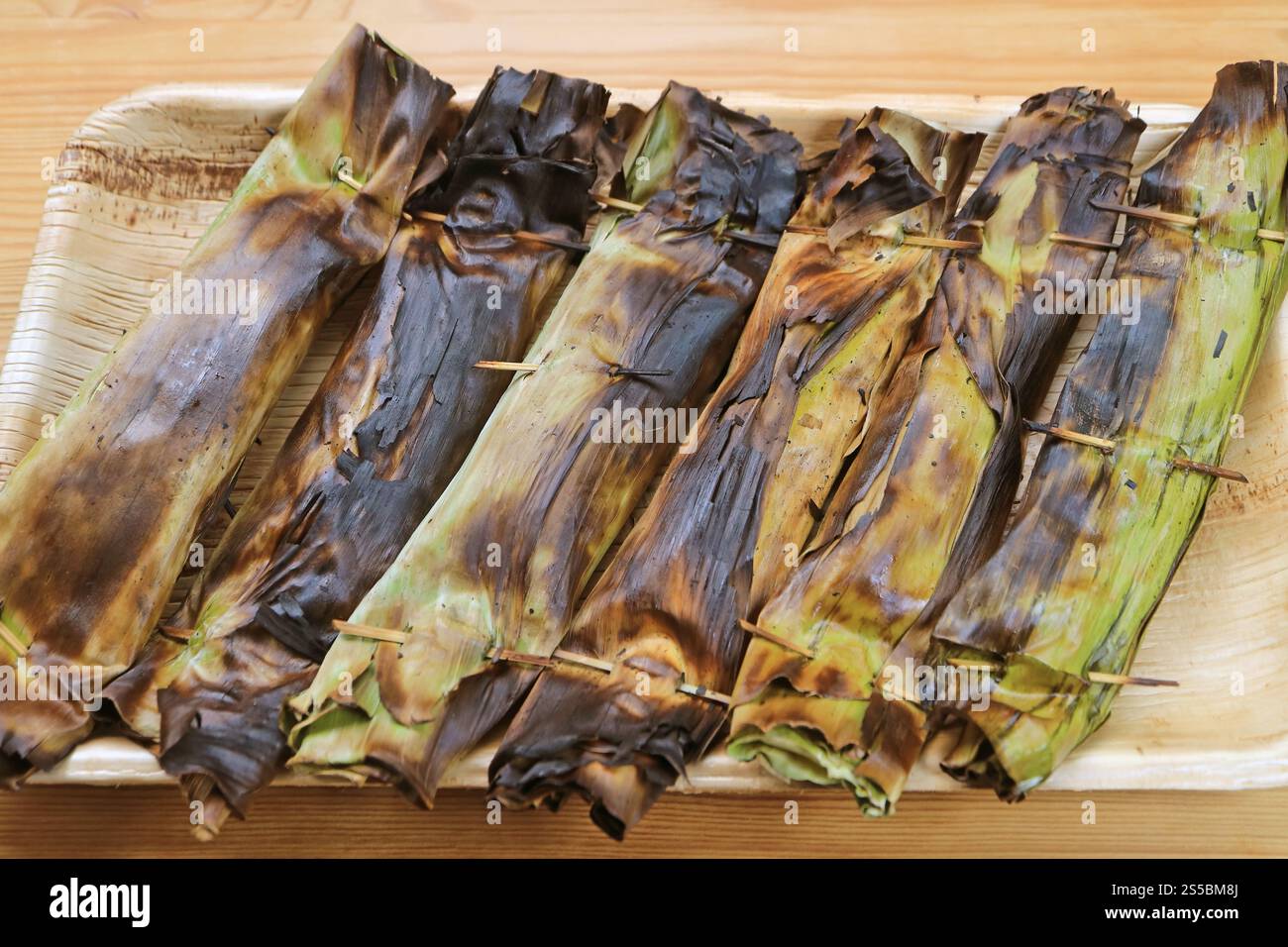 Charcoal Grilled Thai Sweetened Sticky Rice with Fillings Wrapped in ...
