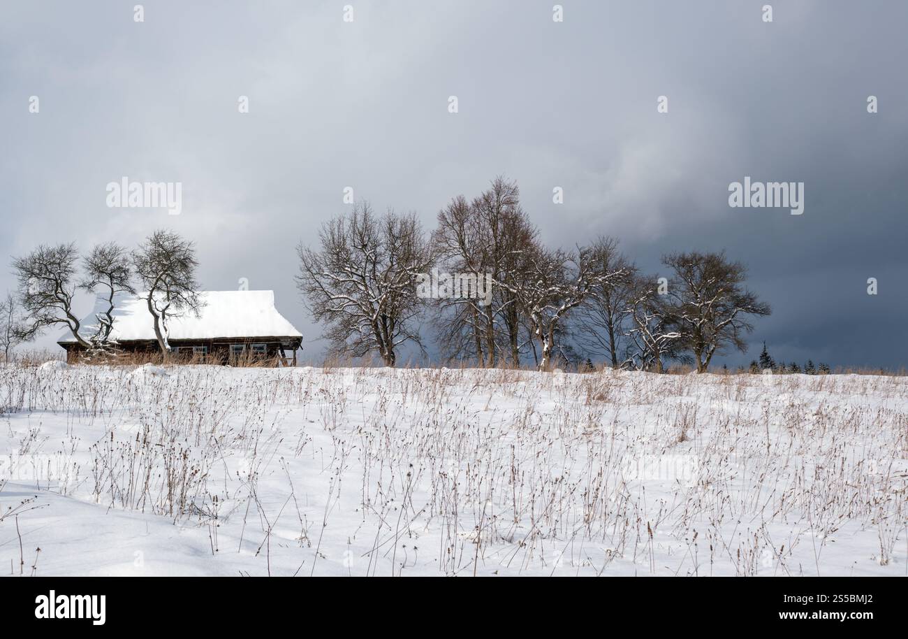 Winter remote alpine mountain village outskirts, countryside hills ...