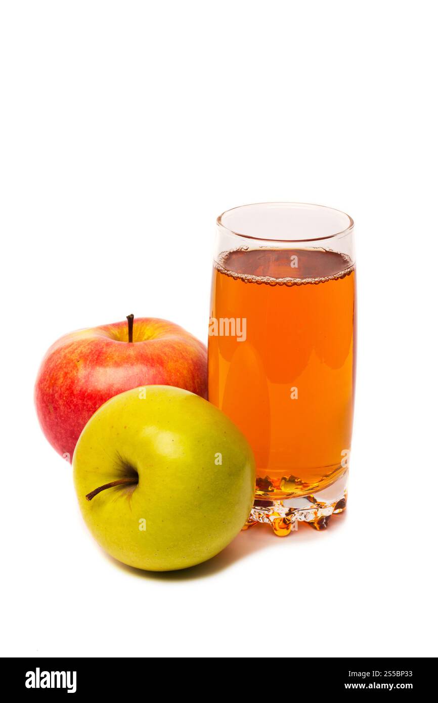 glass of apple juice and apples isolated on white. glass of apple juice ...
