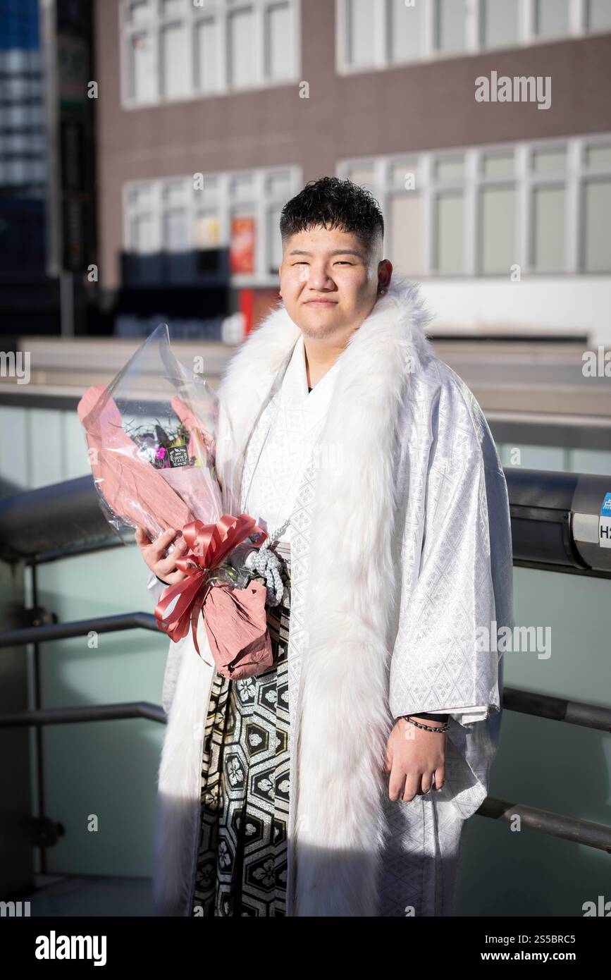 Yokohama, Japan. 13th Jan, 2025. Coming of Age Ceremony participant poses for a portrait in Shin ...