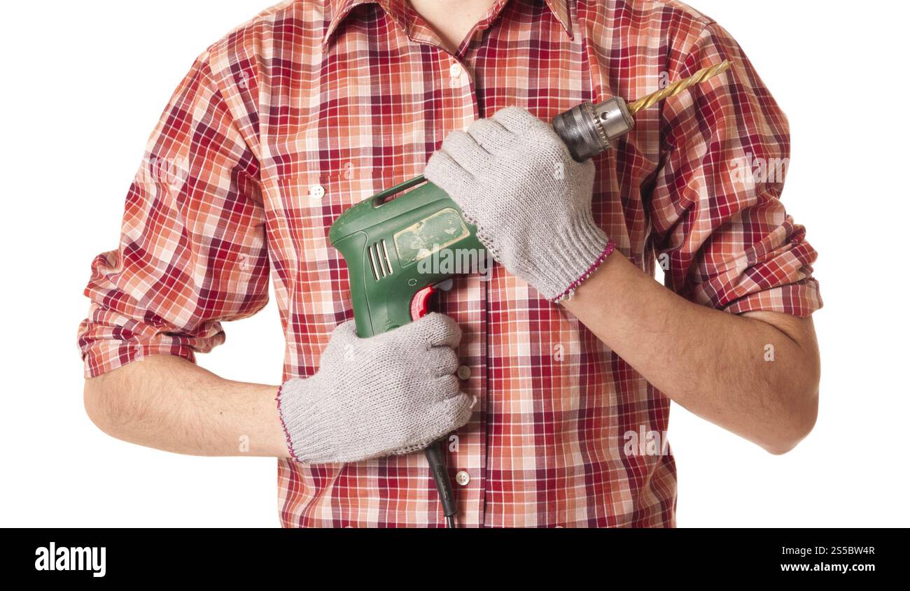 hands handling an electric drilling machine isolated on white ...