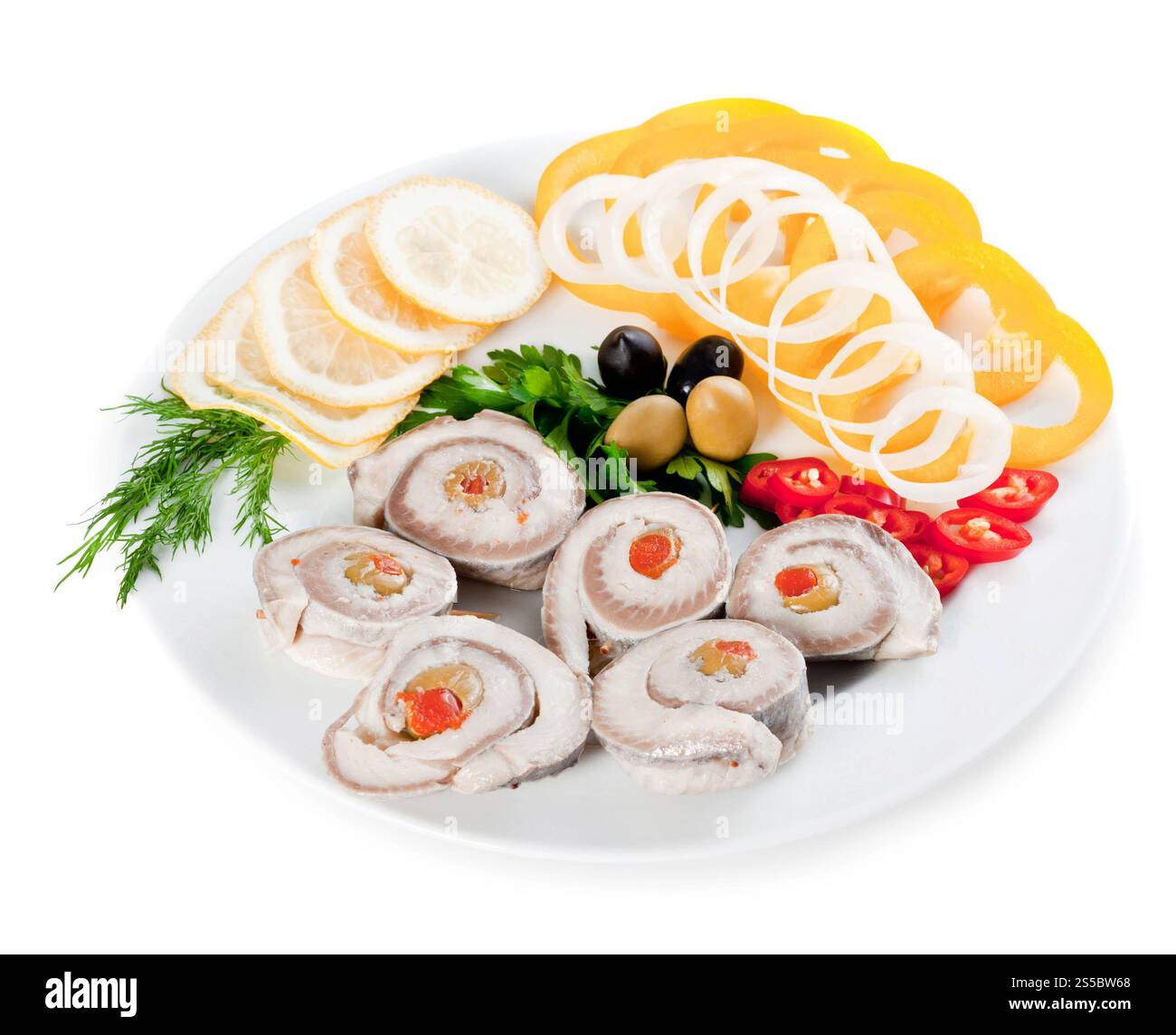 fish with vegetables and olives isolated on white background. fish with ...