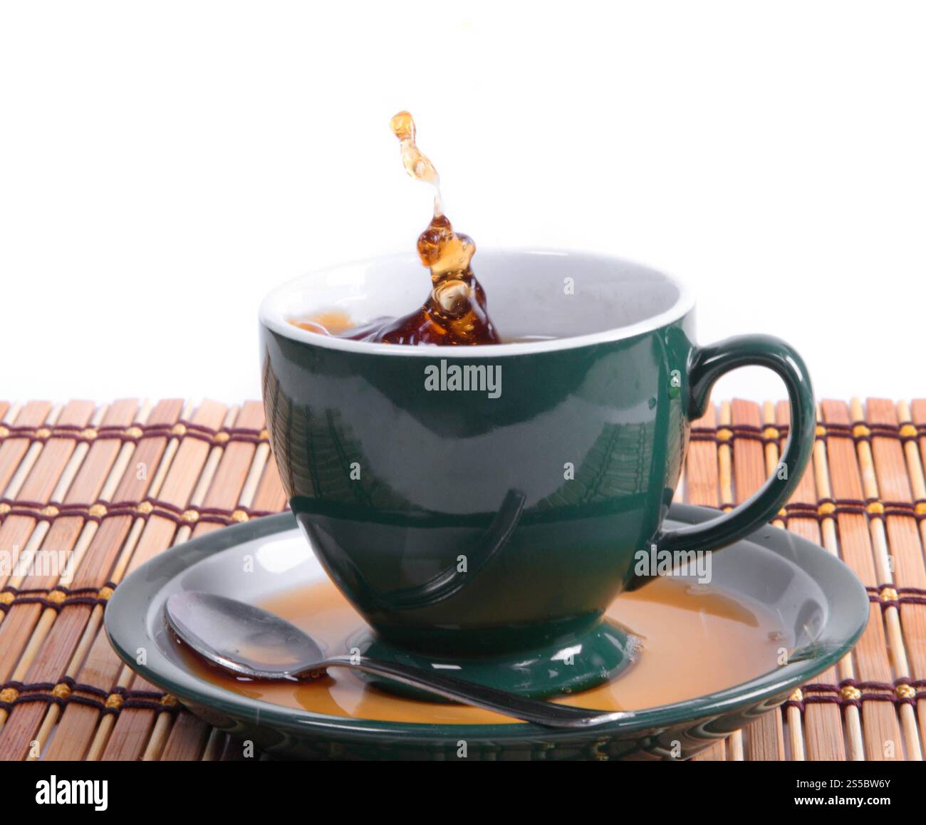 cup of green tea with splash isolated on white background. cup of green ...