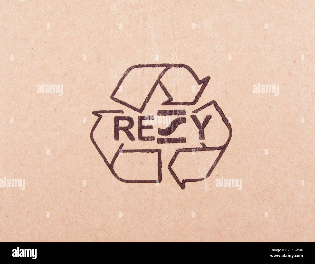 torn out piece of cardboard with recycle symbol close up. torn out ...