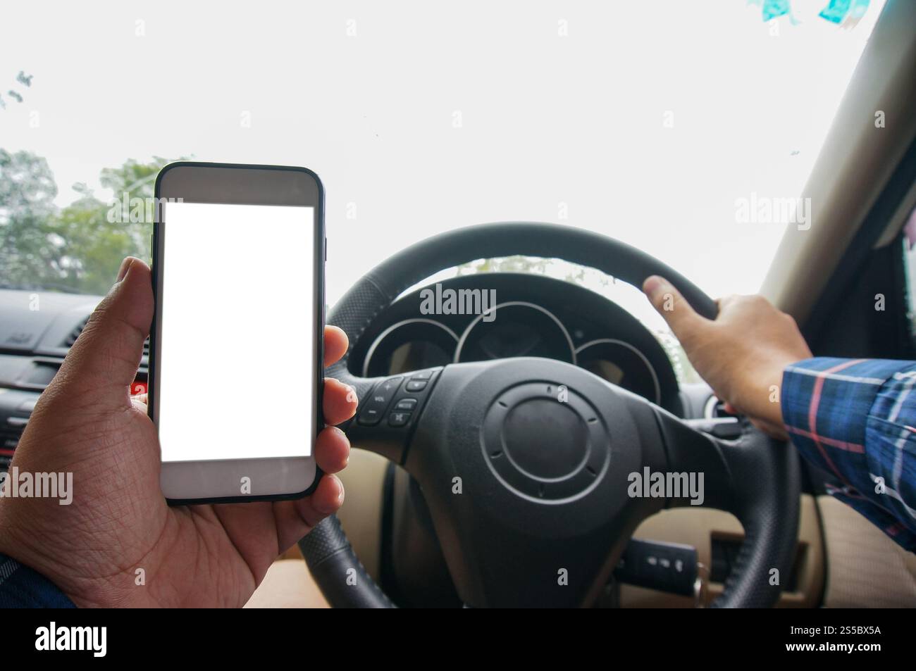 Man Using Mobile Phone Device While Driving. Cropped shot view Man ...