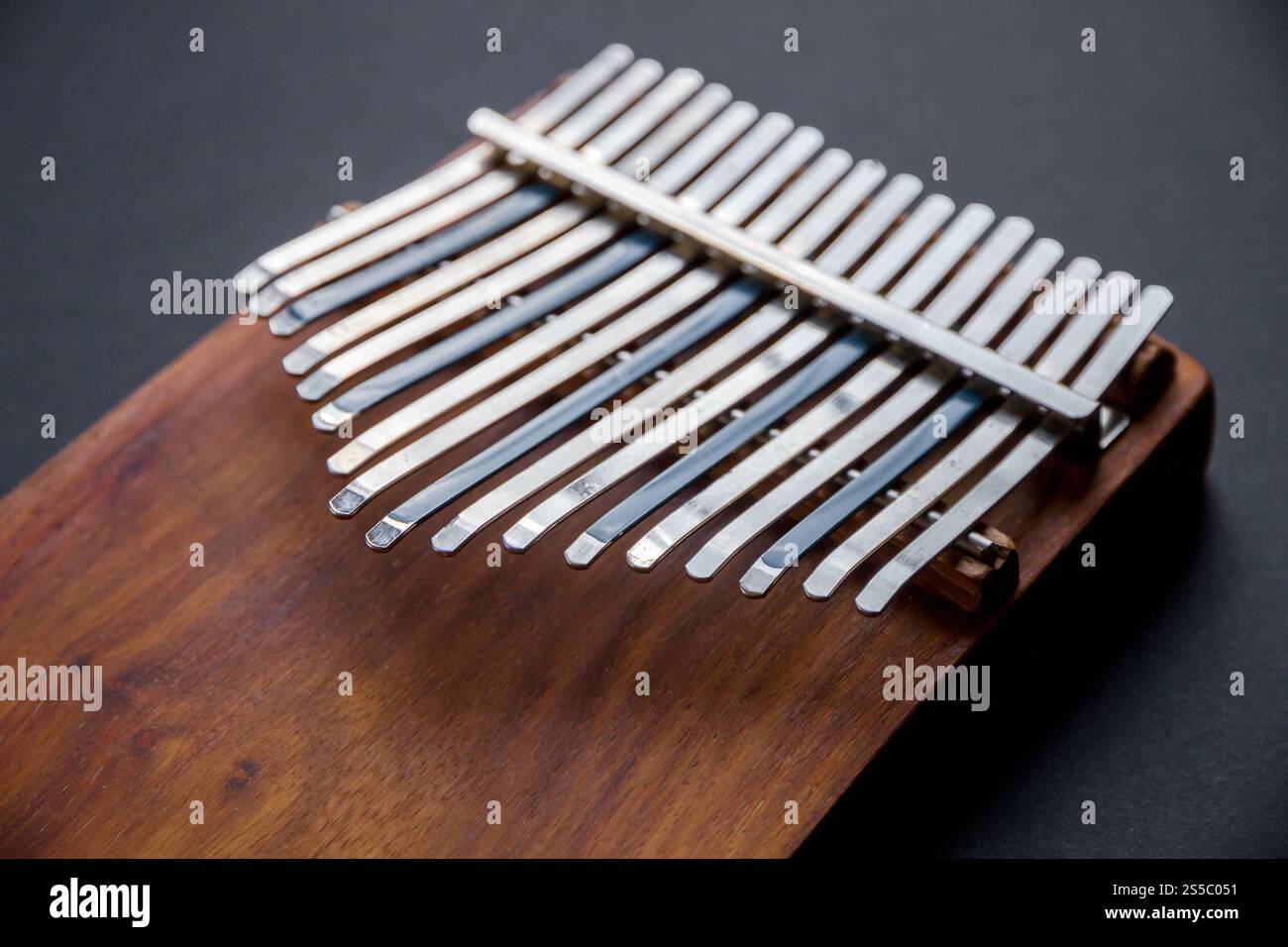 Traditional wooden kalimba isolated on black background. Traditional ...