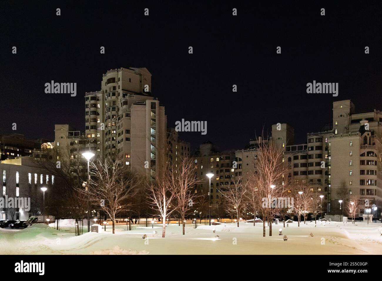 snow-covered square near apartment buildings in center of Moscow city ...