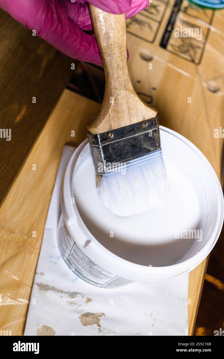 Brush dipped bucket white paint hi-res stock photography and images - Alamy